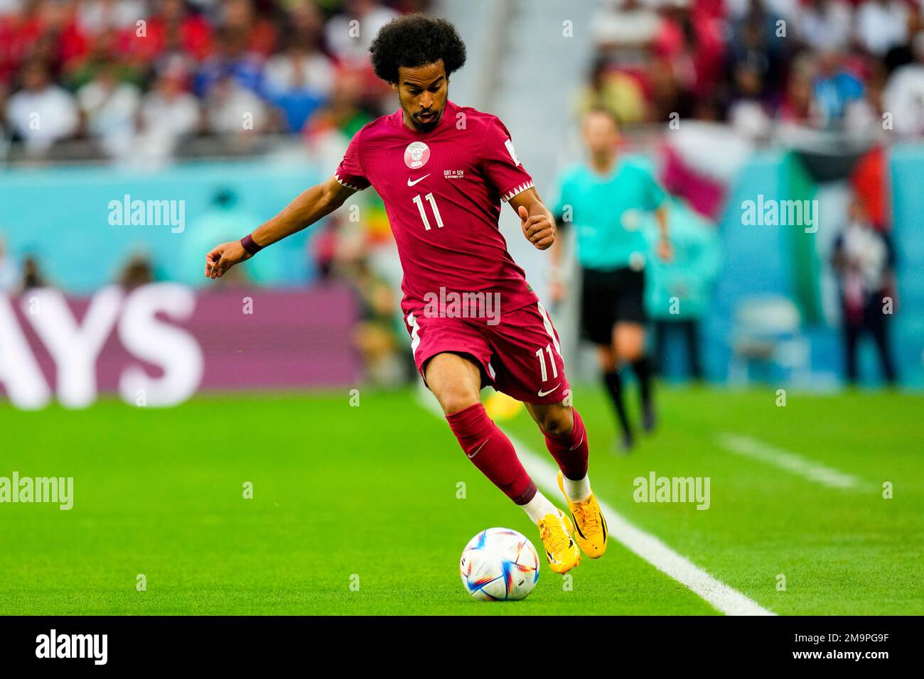 Qatar's Akram Afif controls the ball during a World Cup group A soccer ...