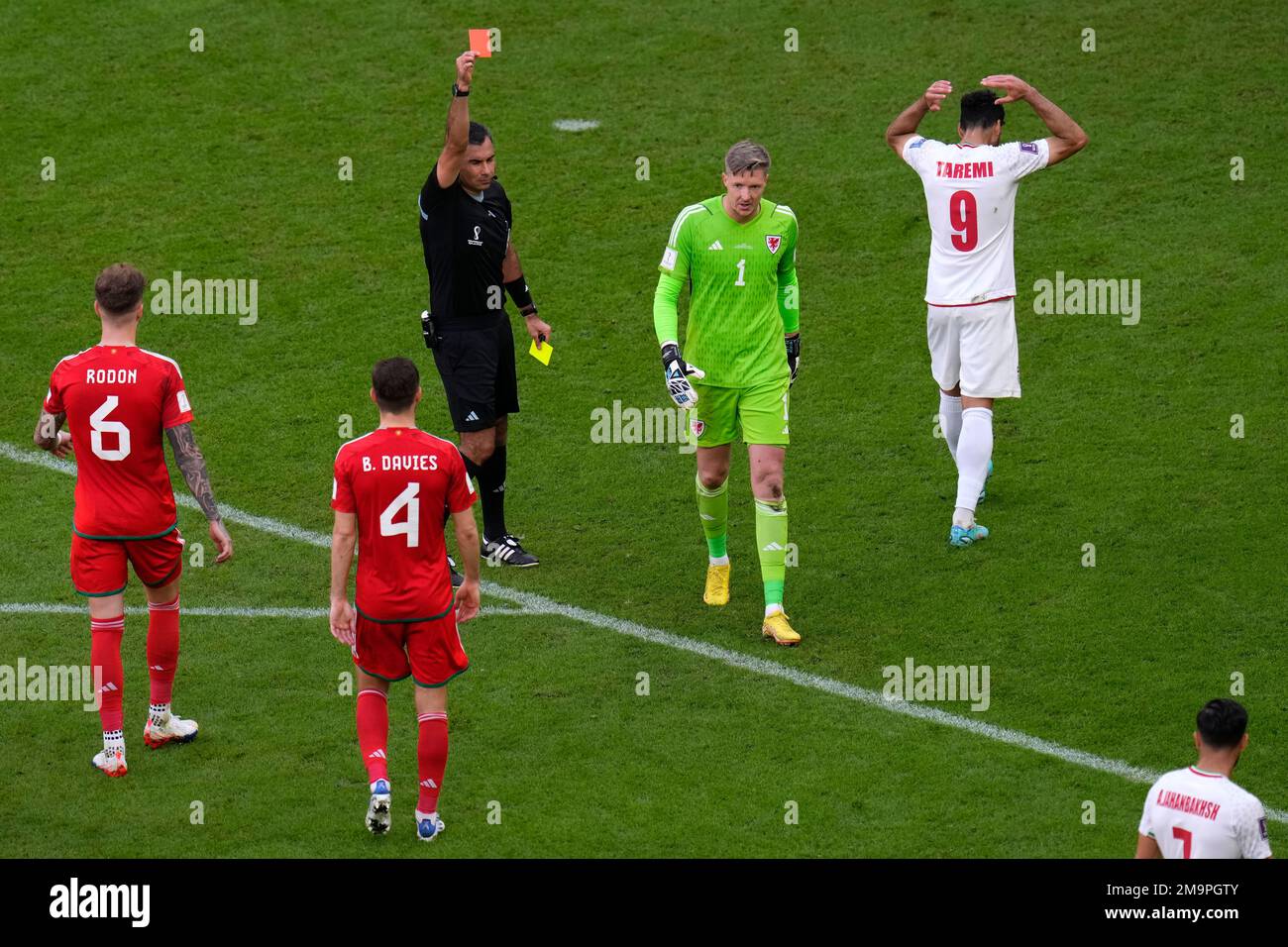 Referee Mario Alberto Escobar Toca shows a red card to Wales ...