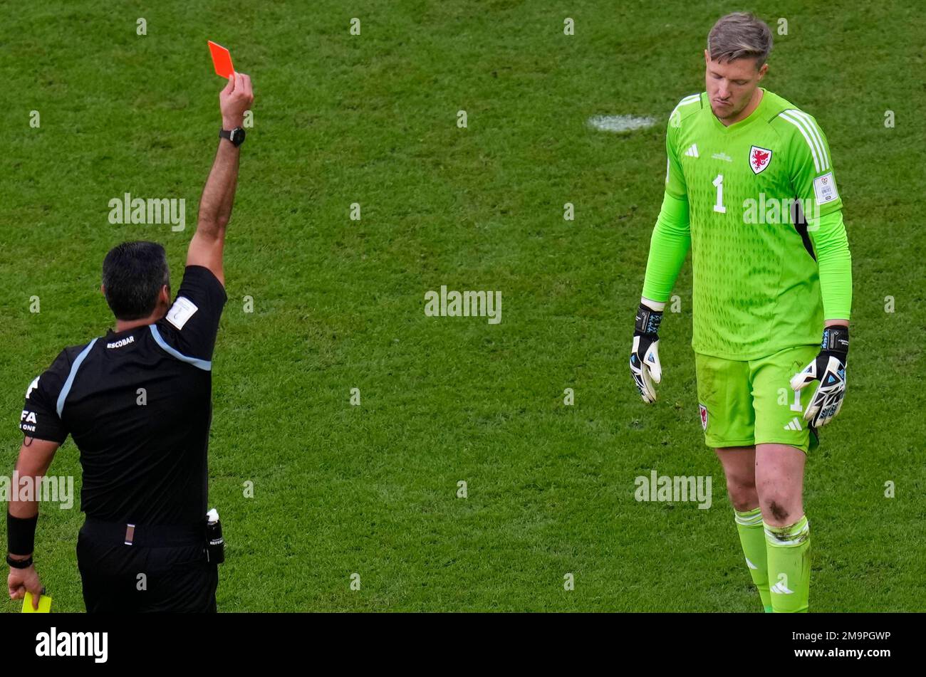 Referee Mario Alberto Escobar Toca shows a red card to Wales ...