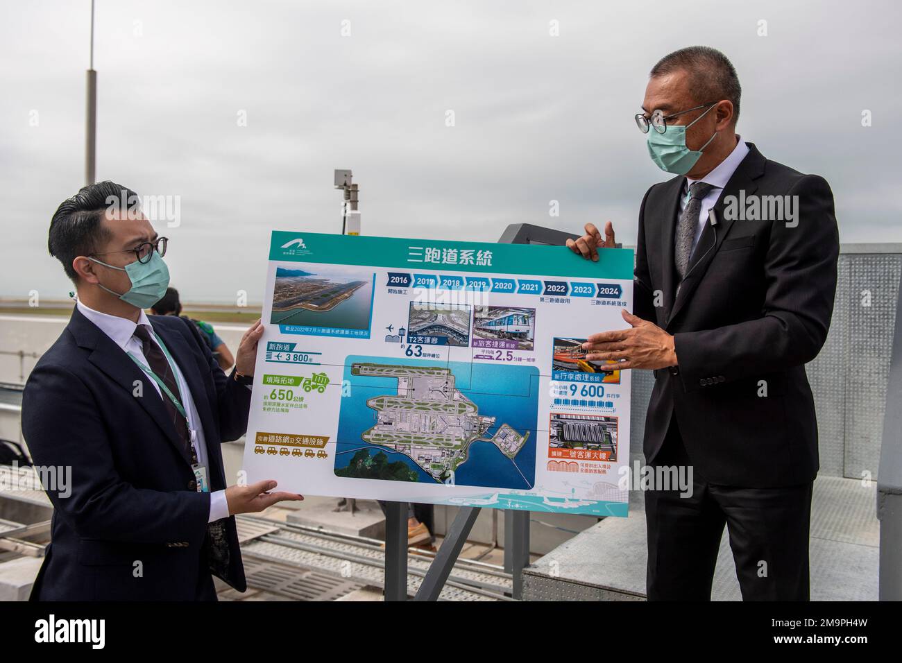 Steven Yiu, right, the Deputy Director of Airport Operations for the ...