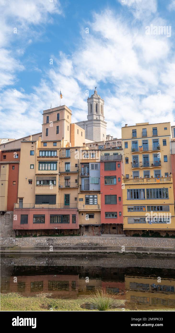 Colorful houses reflected in the Onyar river, in Girona, Catalonia ...