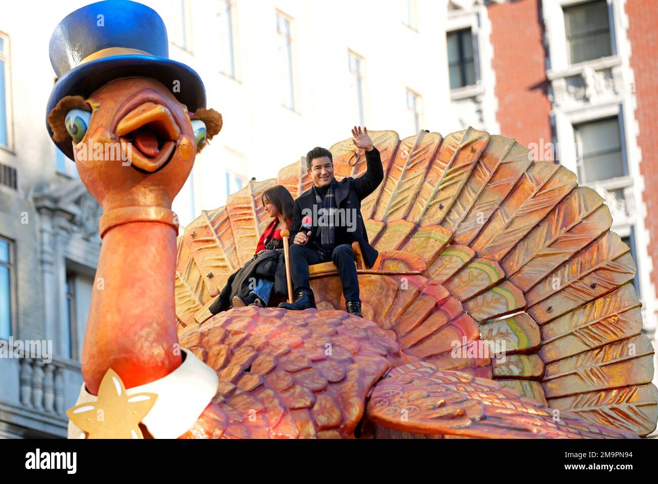 Gia Lopez and Mario Lopez ride the Tom Turkey float in the Macy's ...