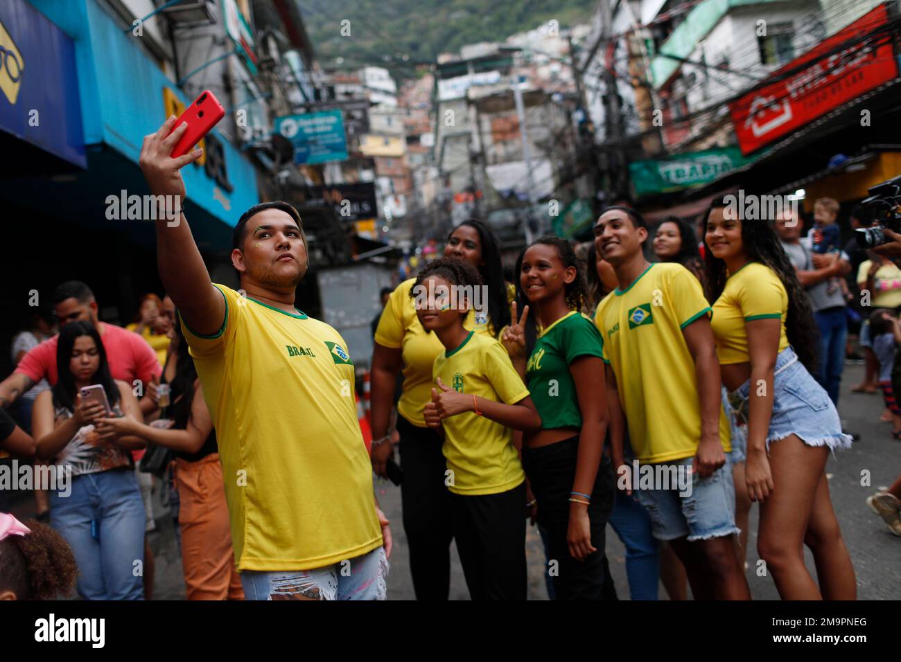 Brazil soccer fans take a group photo on the sidelines of watching the ...