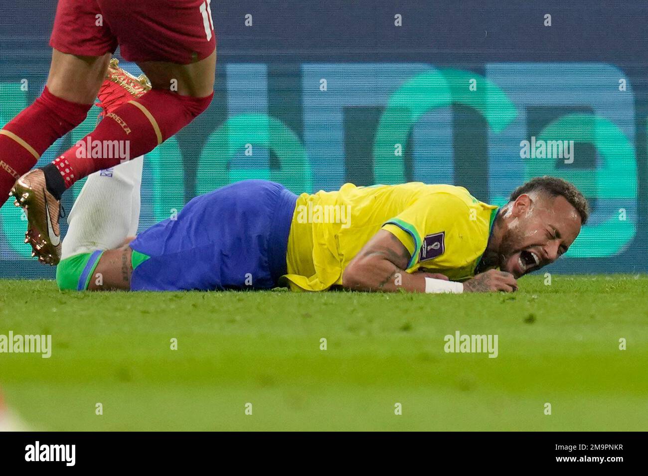 Brazil's Neymar grimaces as he falls to the ground during the World Cup ...