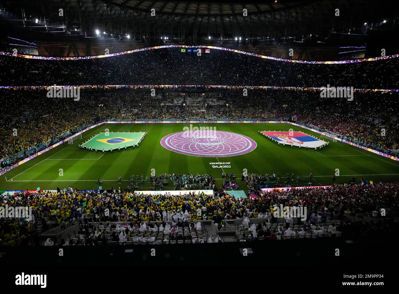 Giant flags of Brazil, left, and Serbia are seen on the pitch prior the ...
