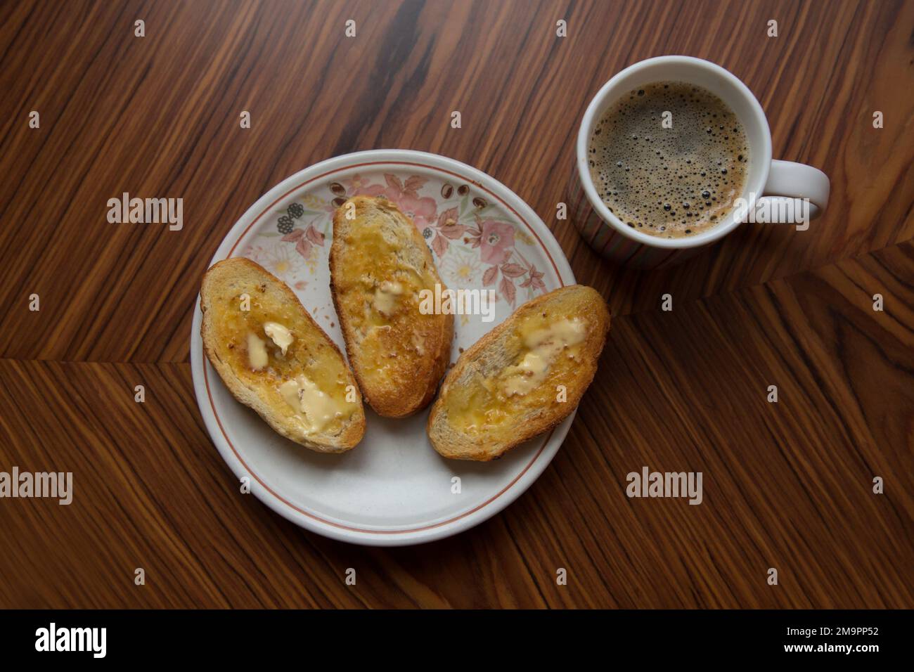 Hot Buttery Toast and a cup of black organic americano coffee Stock ...