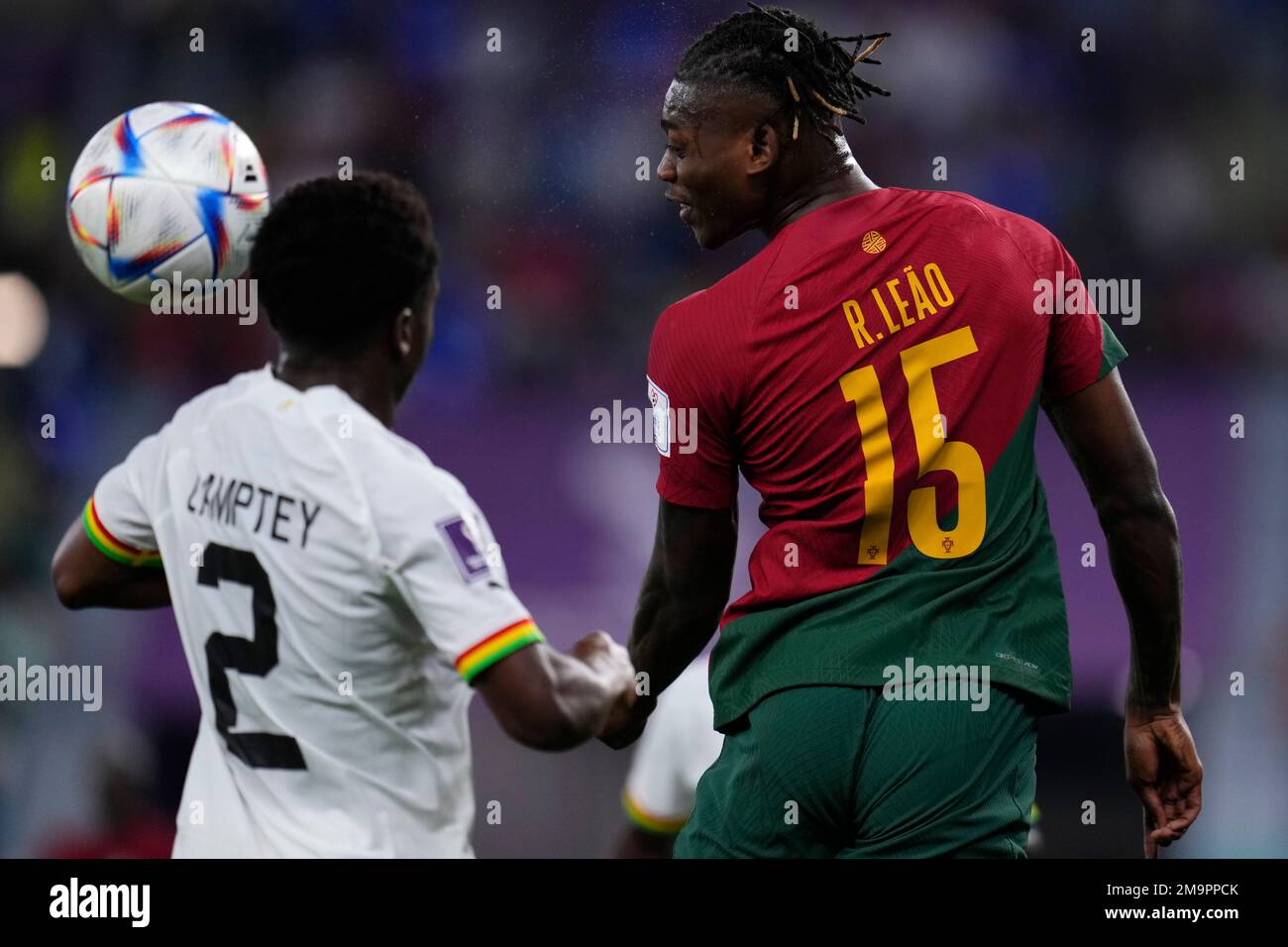 Portugal's Rafael Leao and Ghana's Tariq Lamptey go for a header during a World Cup group H ...