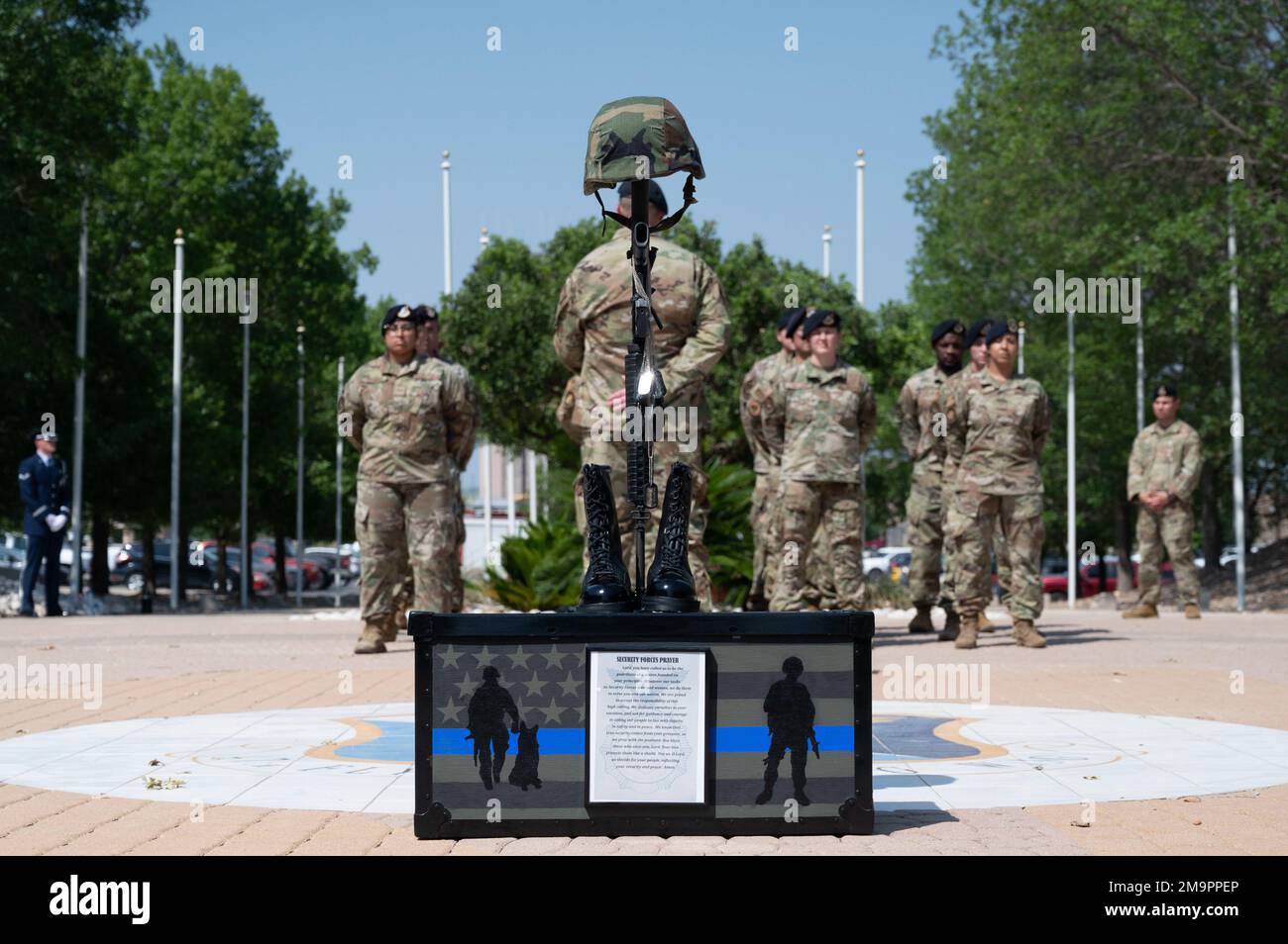 Members of the 47th Security Forces Squadron stand in front of a ...