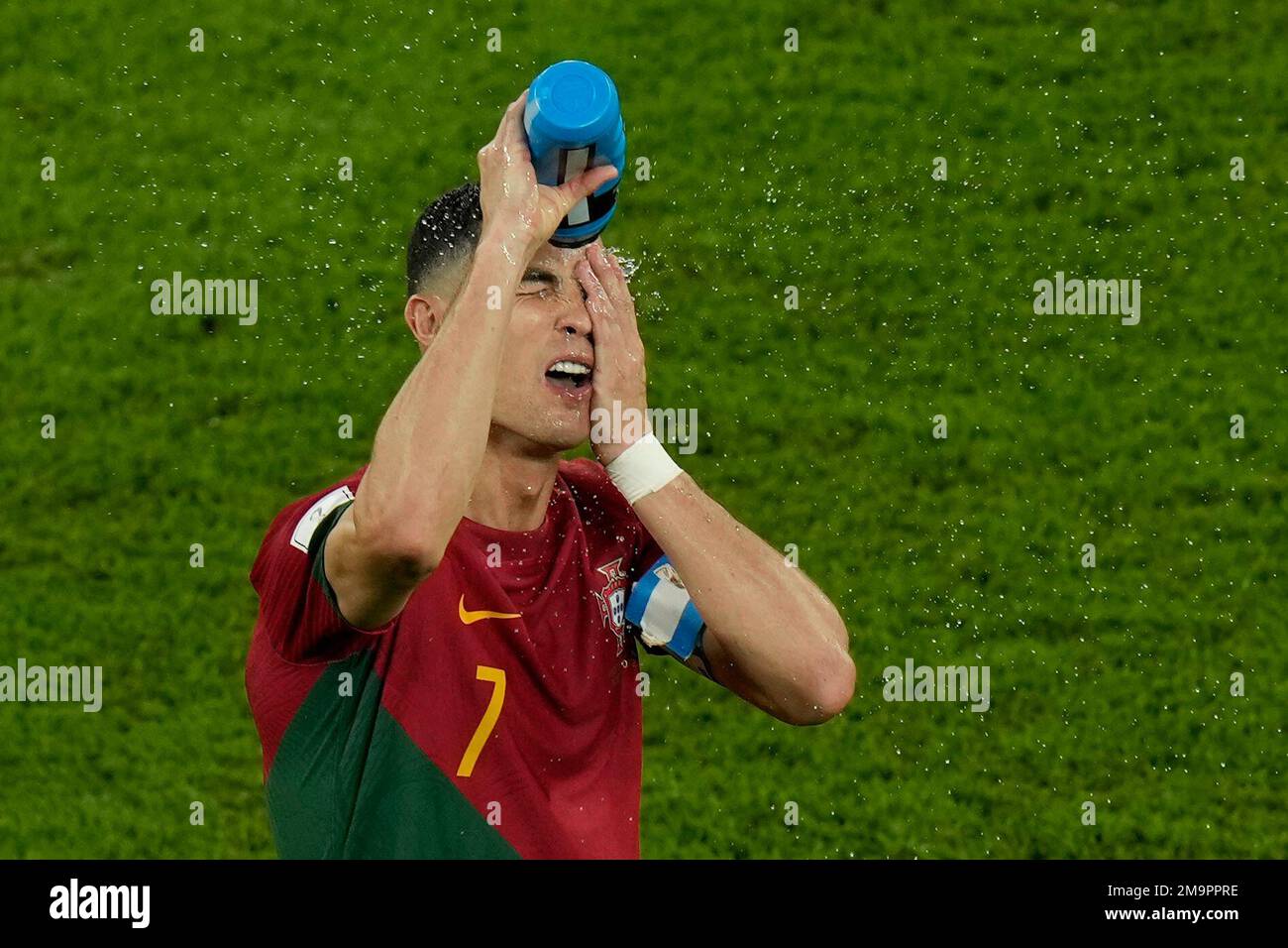 Portugal's Cristiano Ronaldo splashes his face with water during the ...
