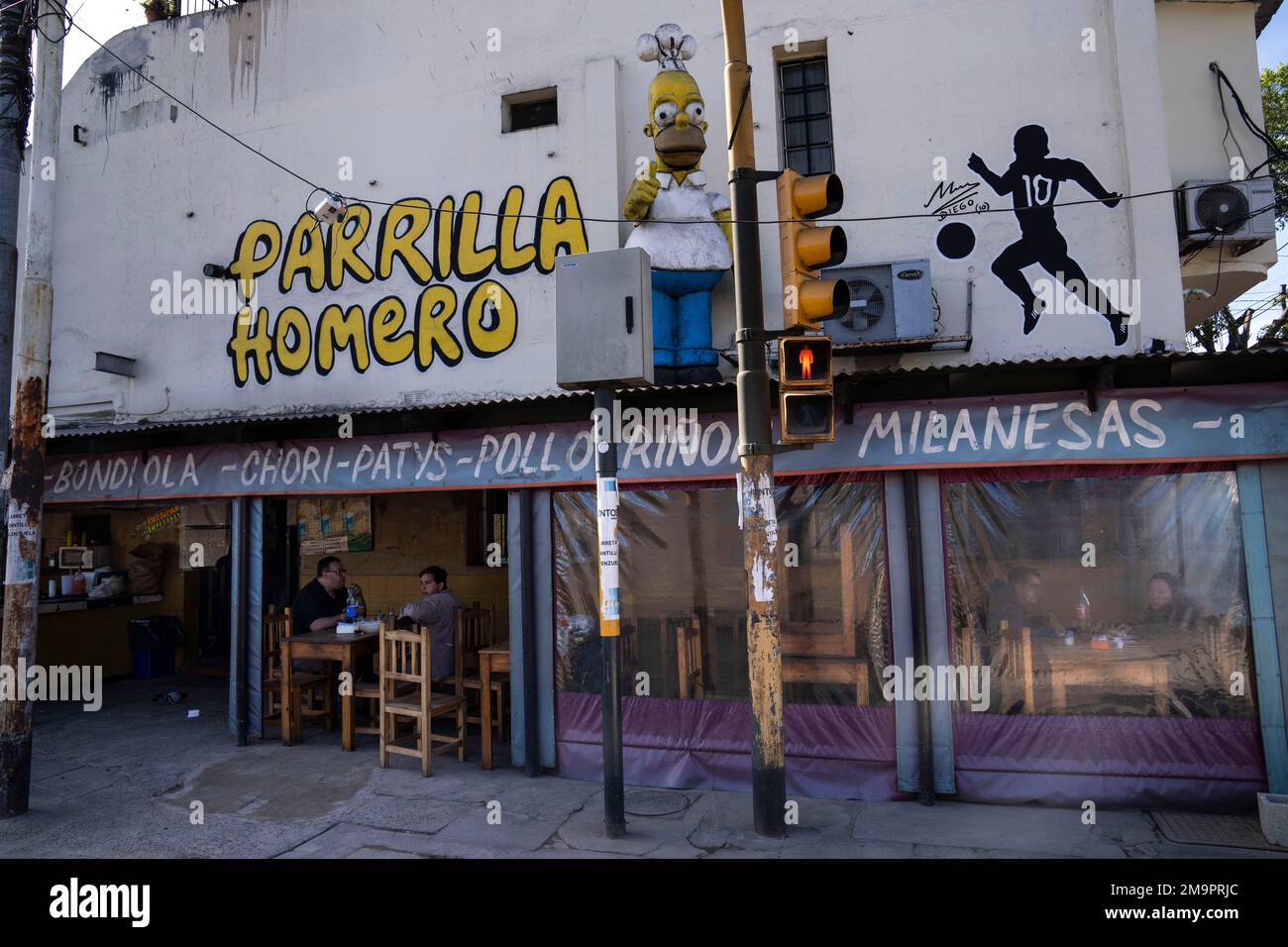A sculpture of Homer Simpson flashing a thumbs up and wearing a chef's ...