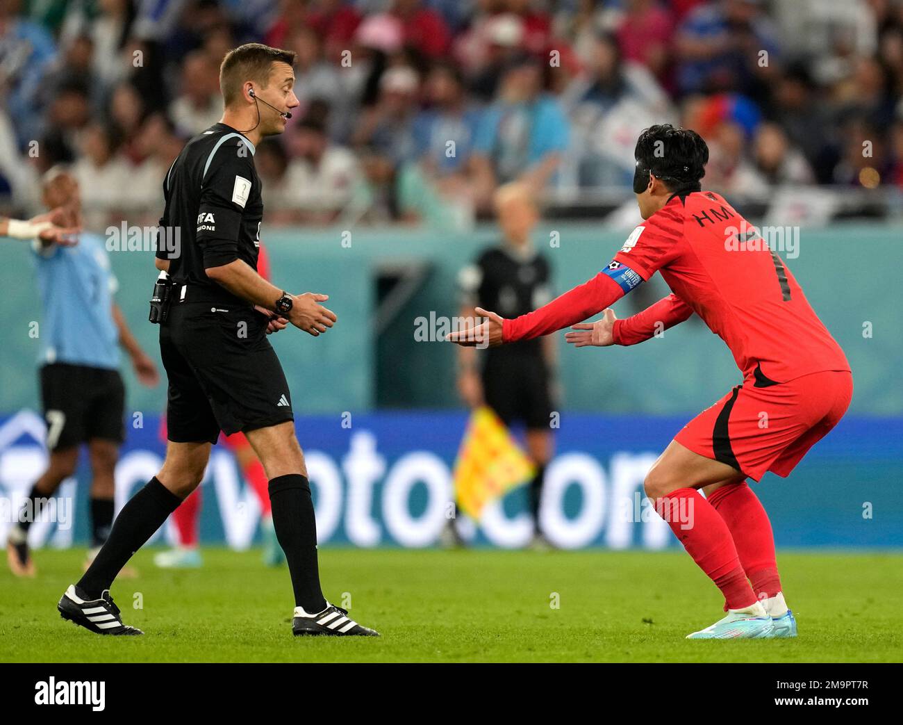 South Korea's Son Heung-min, right, discusses with referee Clement ...