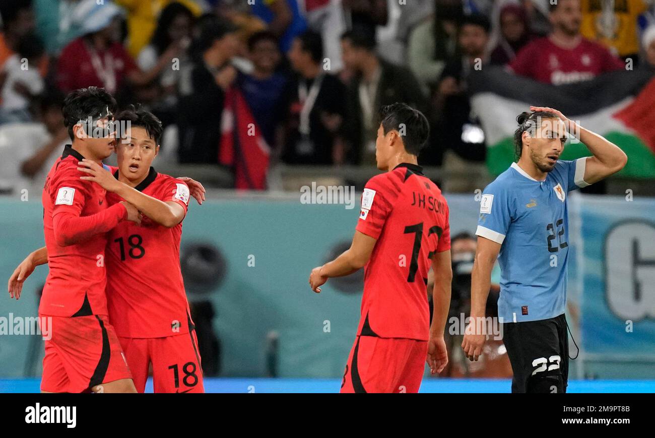 South Korea's Son Heung-min, left, hugs with South Korea's Lee Kang-in at the end of the World ...