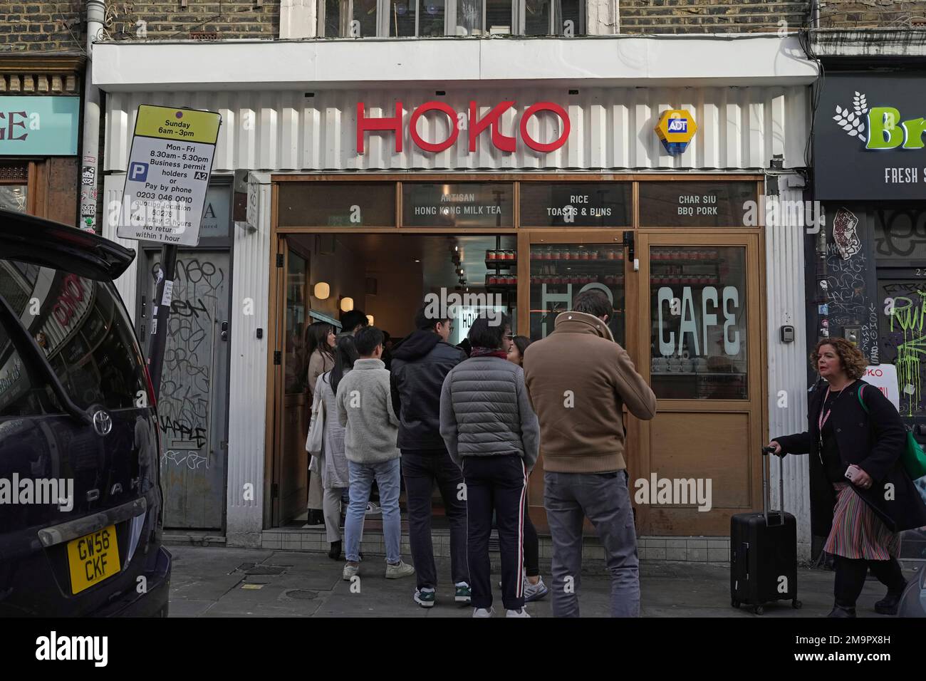 Customers line up outside the HOKO Cafe, a pop-up cafe in the trendy ...