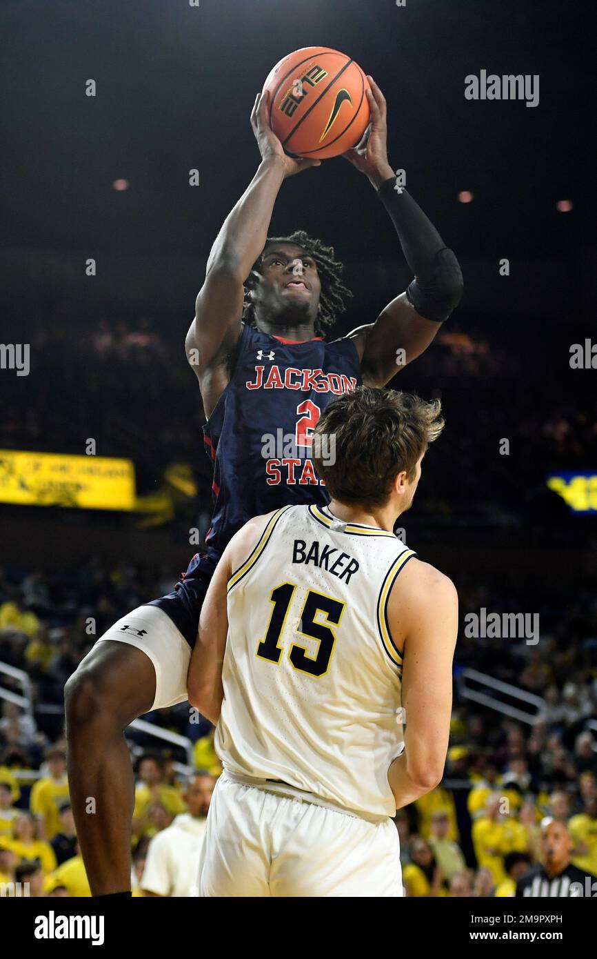 Jackson State guard Ken Evans Jr., top, shoots over Michigan guard Joey ...