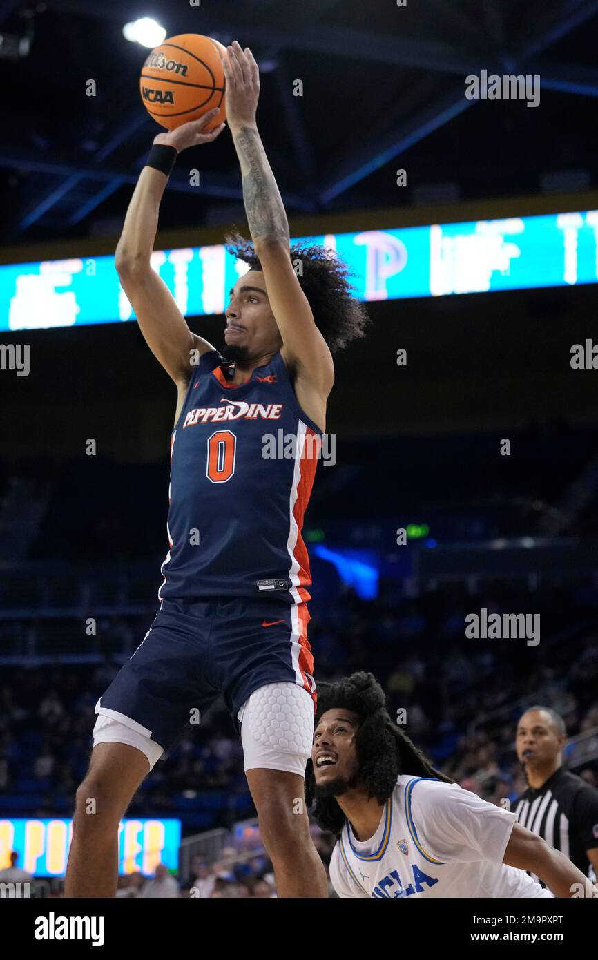 Pepperdine guard Houston Mallette (0) shoots above UCLA guard Tyger ...