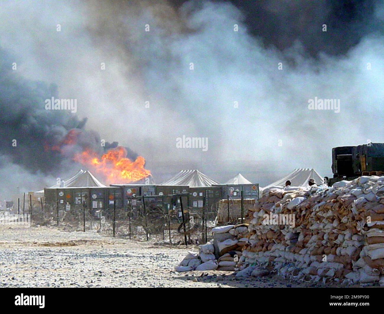Burning tents at Camp Commando. The fire spread causing a loss of forty ...