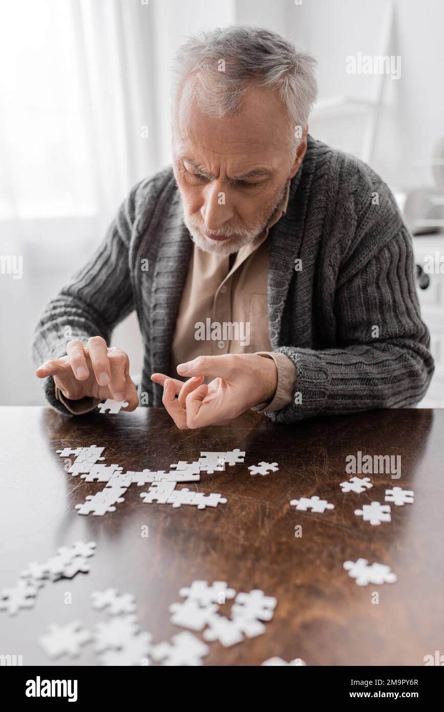 aged man with parkinsonian syndrome and tremor in hands combining ...