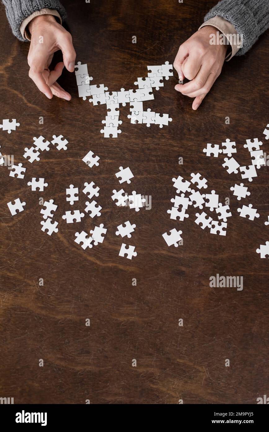 top view of cropped man with trembling hands suffering from parkinson ...