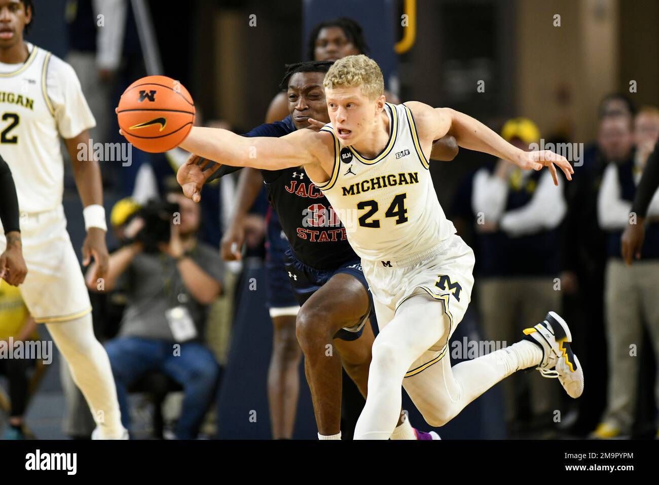 Michigan forward Youssef Khayat (24) and Jackson State forward Jamarcus ...
