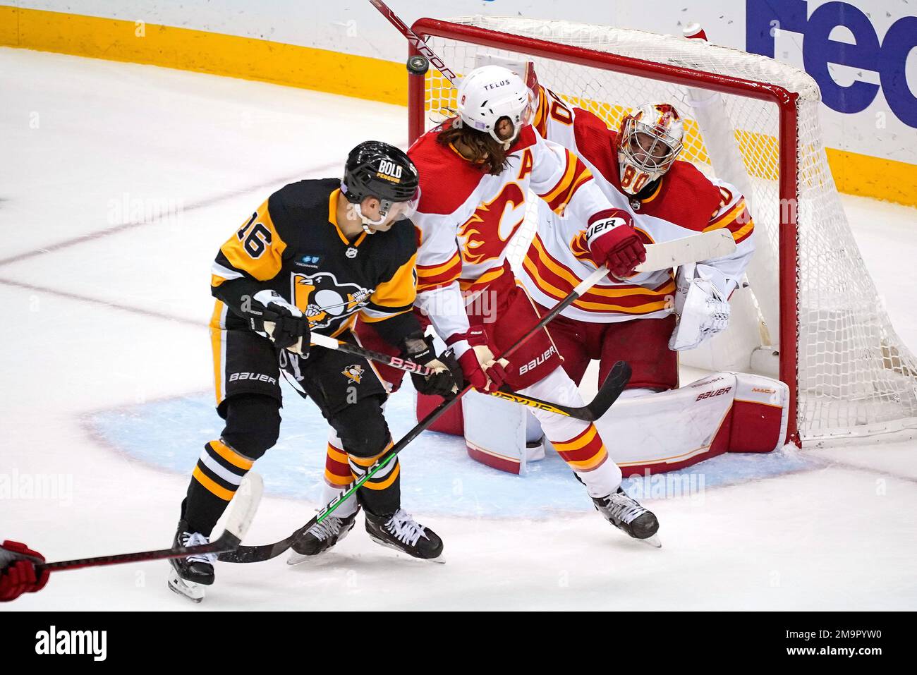 Calgary Flames goaltender Dan Vladar (80) blocks a shot with Chris ...