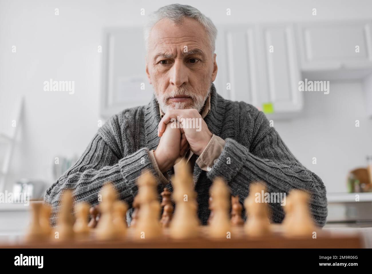 senior man suffering from memory loss and thinking near blurred ...