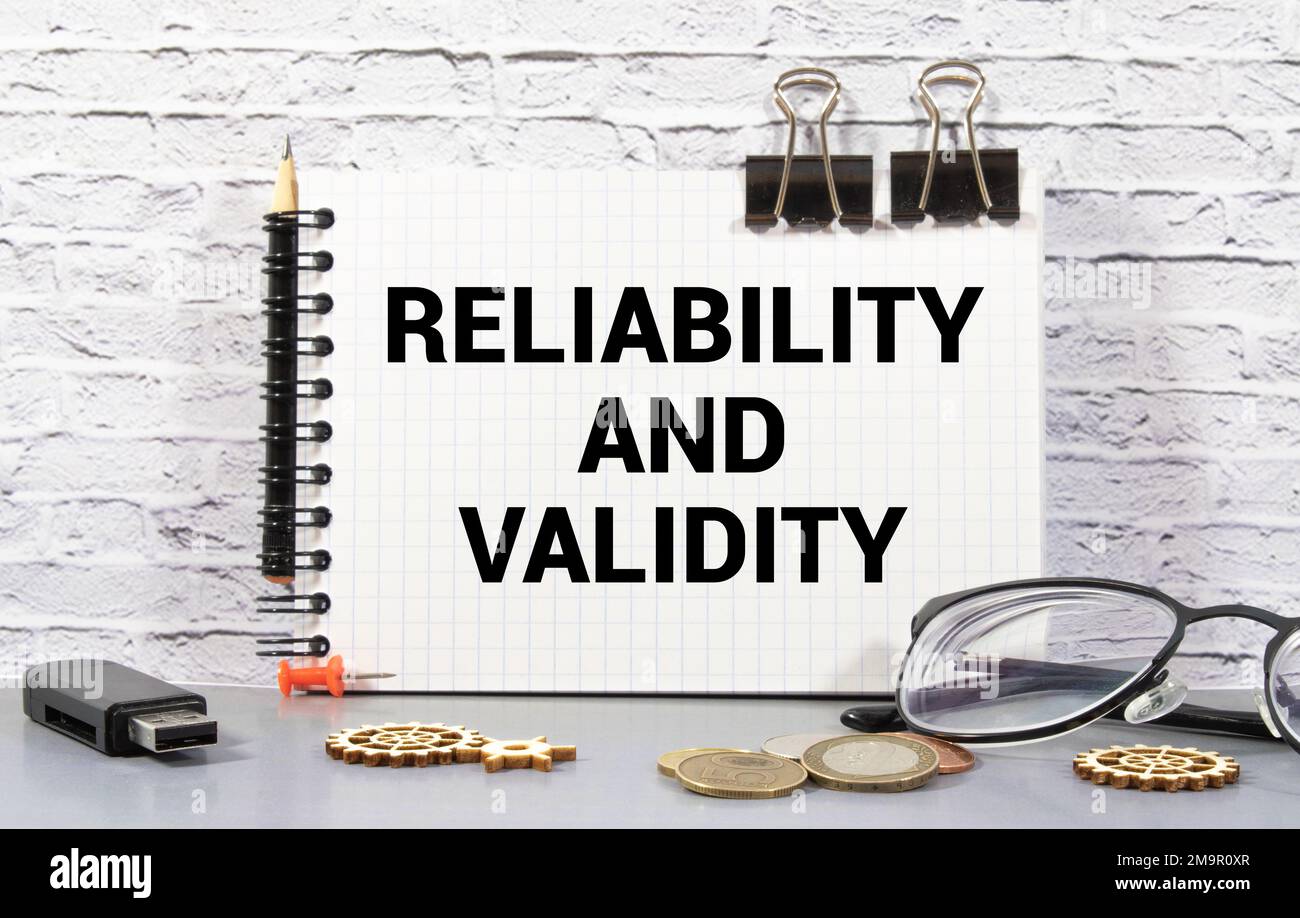 A sign with the inscription Reliability and Validity on the table with ...