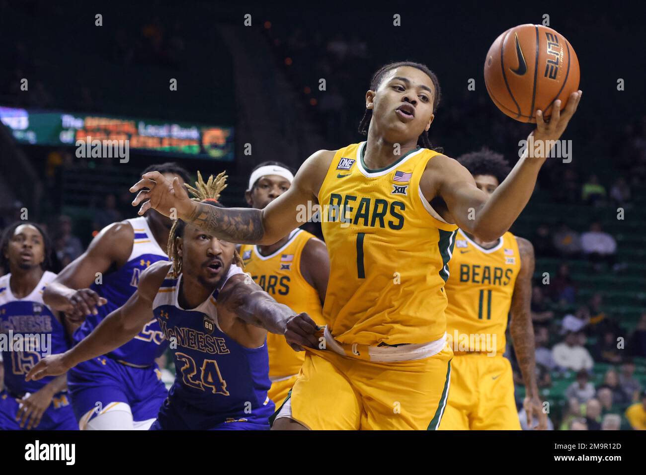 Baylor guard Keyonte George (1) pulls in a loose rebound over McNeese ...
