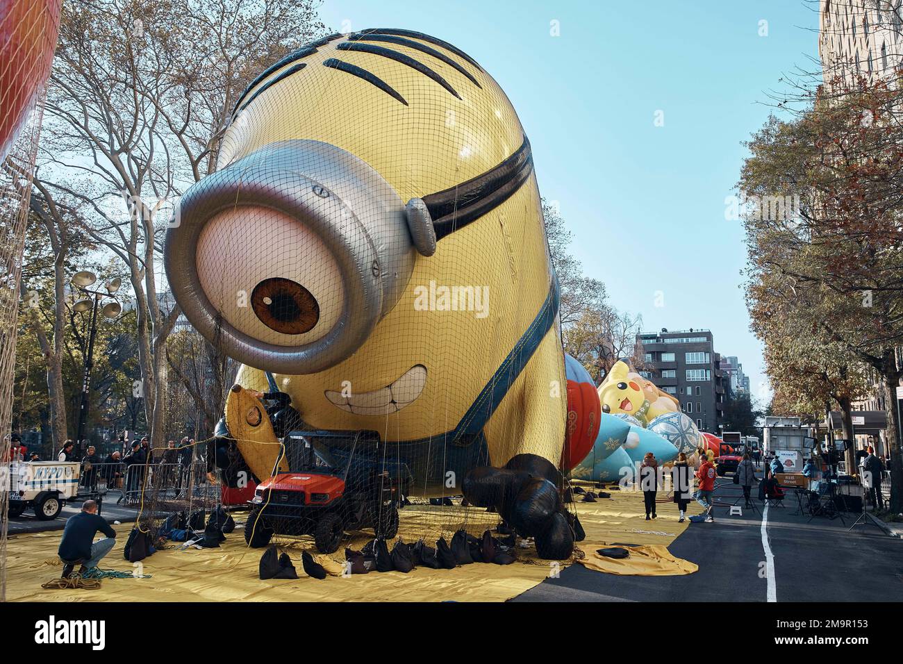 A Man Takes A Photo Of An Inflated Helium Balloon Of Stuart The Minion