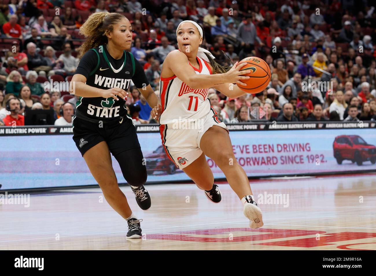 Ohio State's Kaia Henderson, right drives the lane against Wright State ...