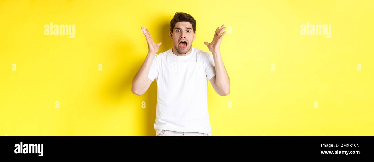 Shocked young man panicking hi-res stock photography and images - Alamy
