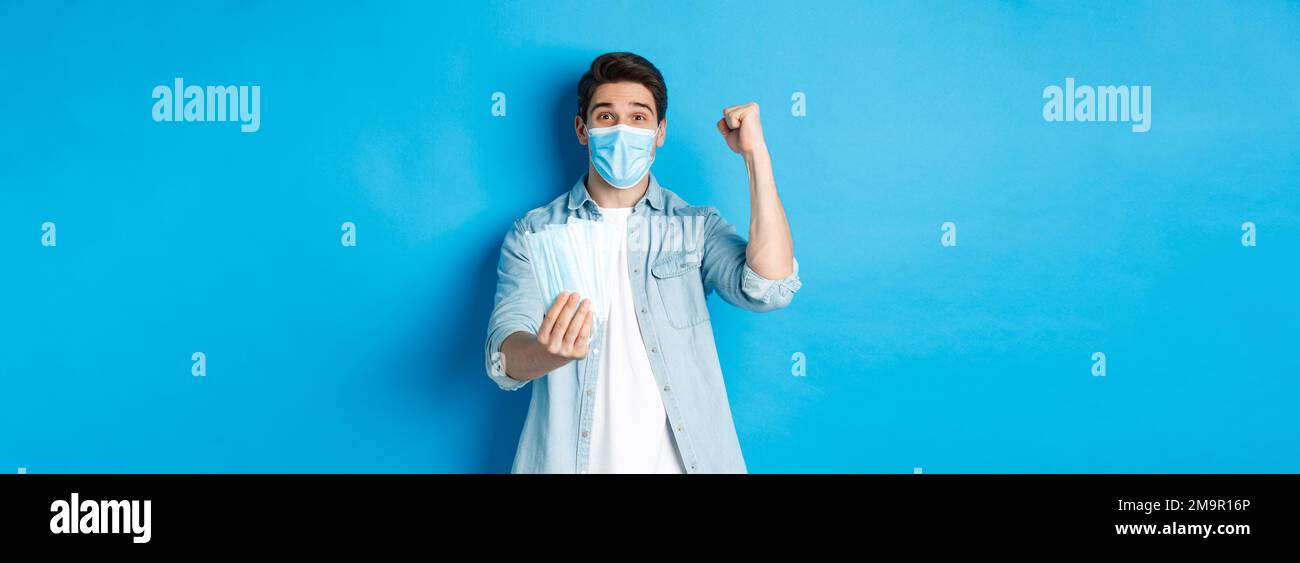 Concept of coronavirus, quarantine and social distancing. Cheerful man ...