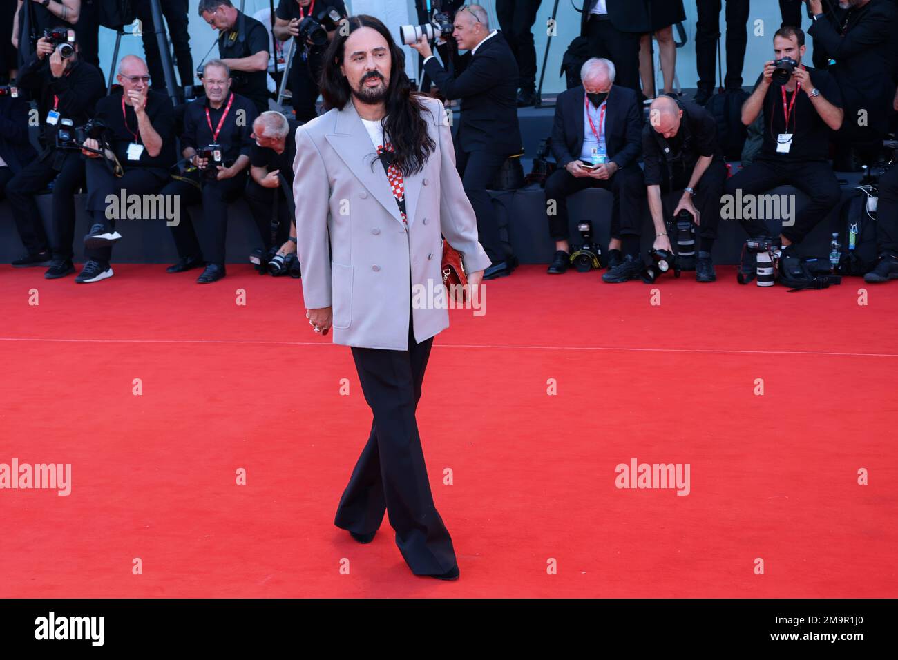 FILE - Alessandro Michele poses for photographers upon arrival at the ...
