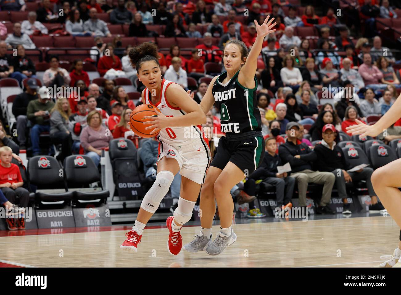 Ohio State's Madison Greene, left, dribbles past Wright State's Emily ...