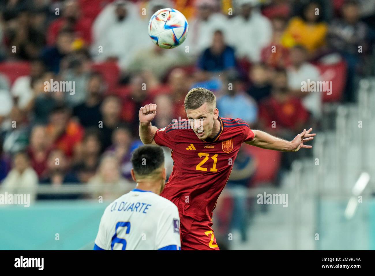 Spain's Dani Olmo, right, heads for the ball with Costa Rica's Oscar ...
