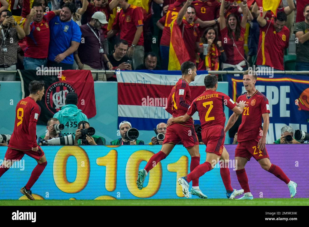 Spain's Dani Olmo, right, celebrates after scoring the opening goal ...