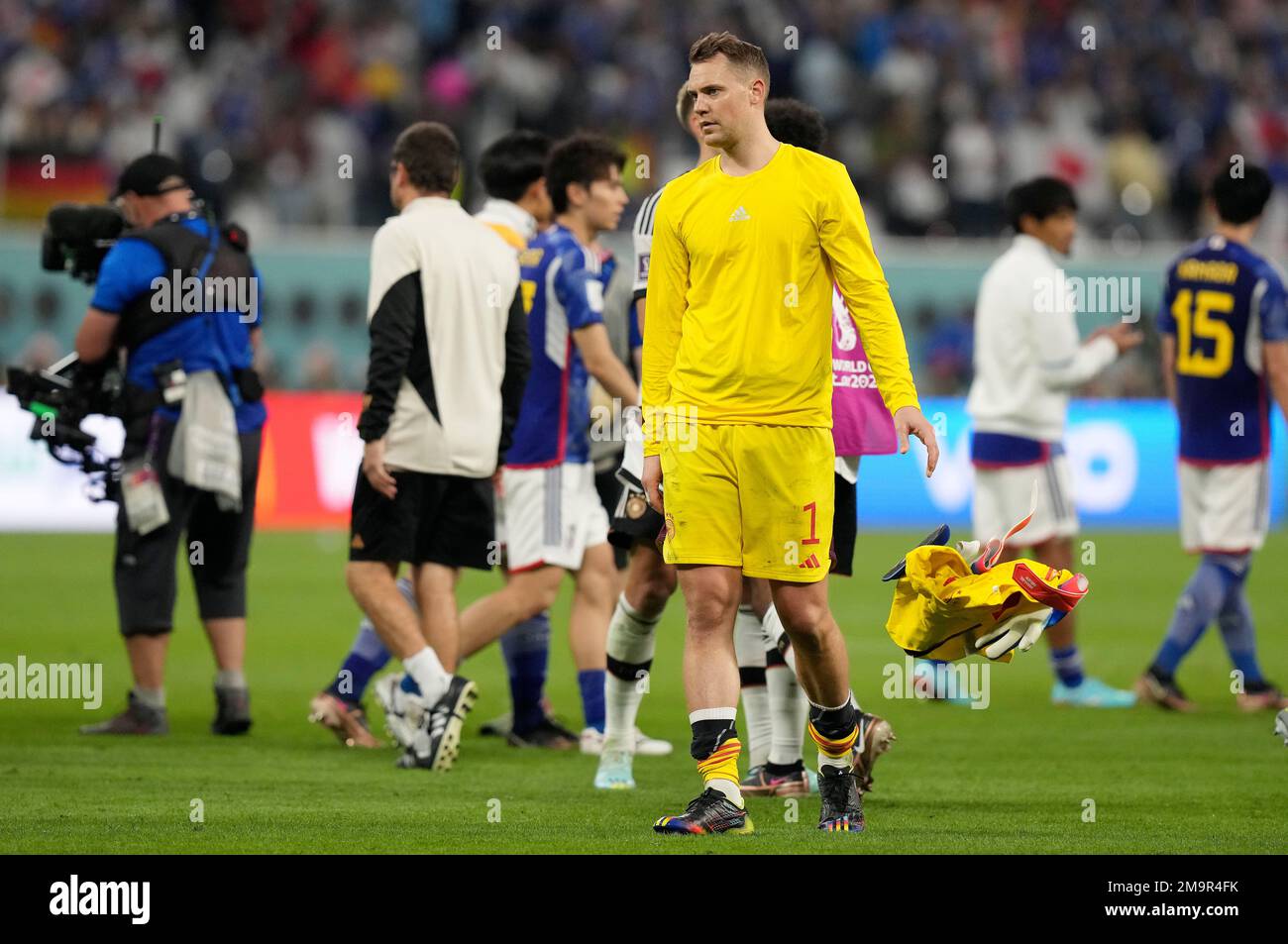 Germany's goalkeeper Manuel Neuer throws away his gloves after losing ...