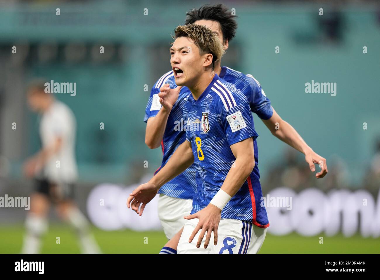 Japan's Ritsu Doan celebrates after scoring his side's opening goal ...