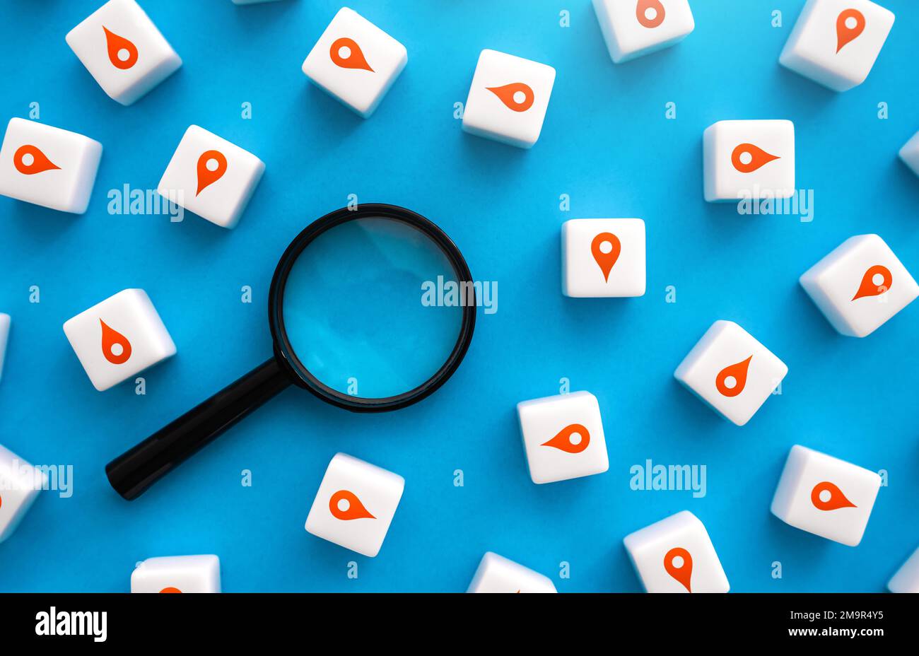 Magnifying glass and many red location pin places for visiting. Search ...