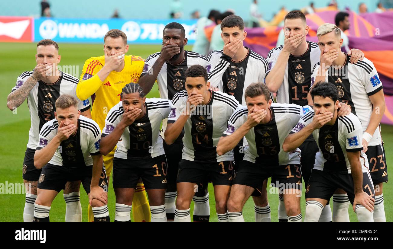 German's team covers their mouth during the team photo prior to the ...