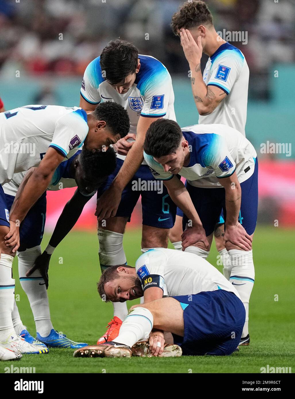 England's Harry Kane, lies on the pitch after being fouled during the ...