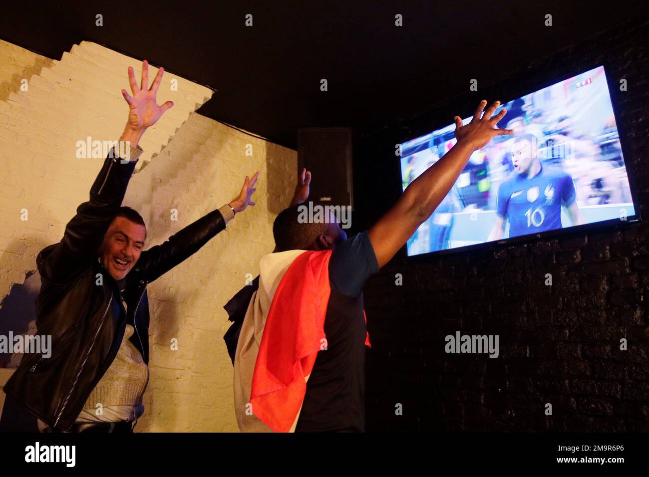 Fans of France's national soccer team celebrate their team's first goal ...