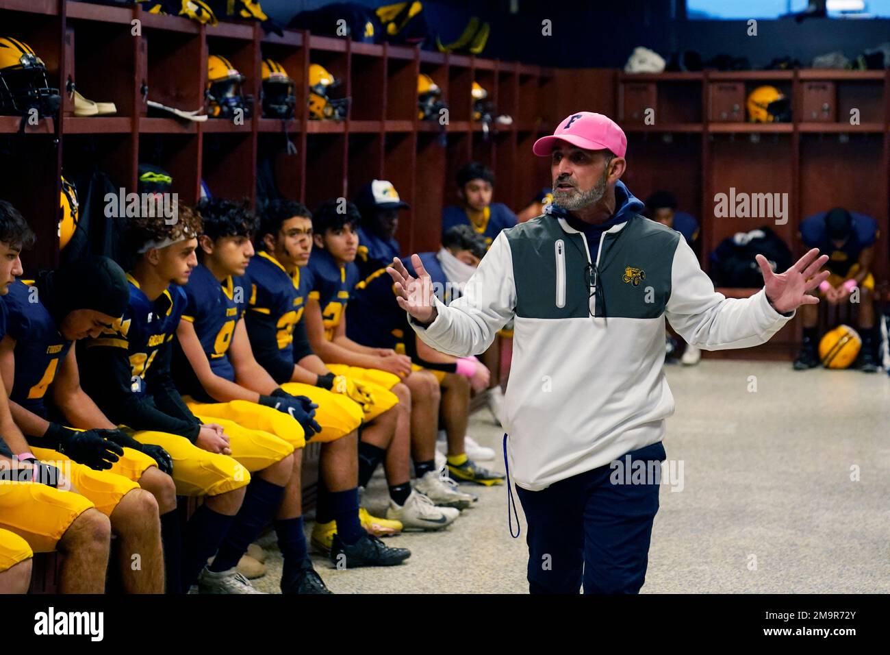 Dearborn Fordson High School head coach Fouad Zaban addresses the team ...