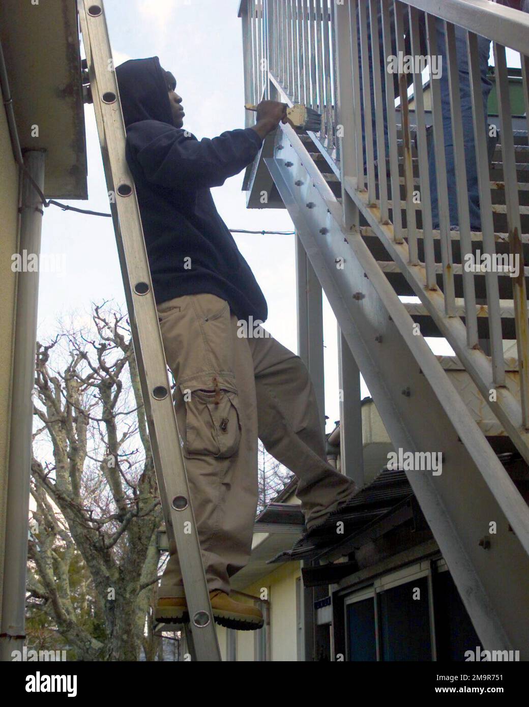 031210-M-4711R-101. A US Marine Corps (USMC) Marine with 5th Battalion ...