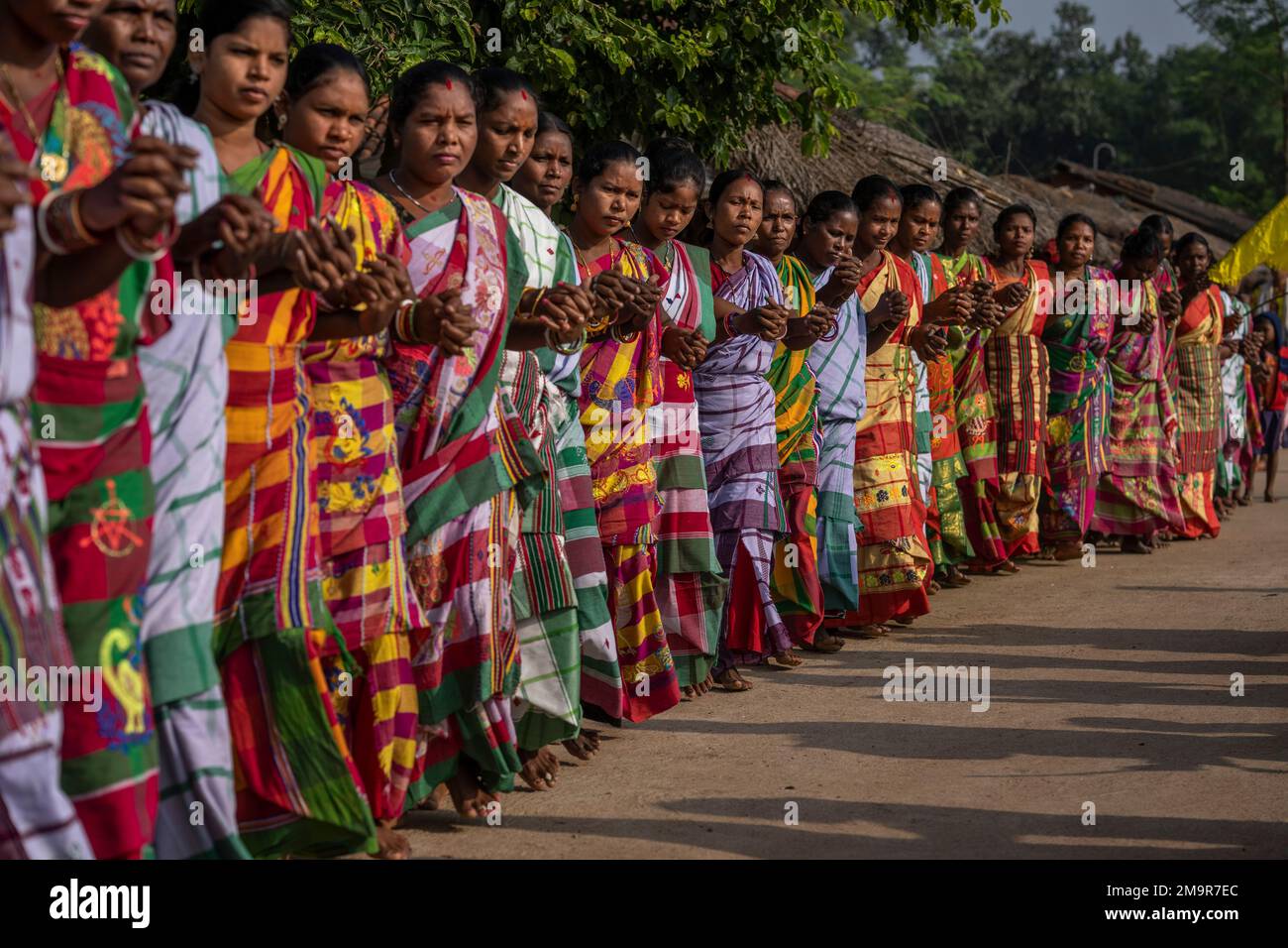 Tribes women dressed up in colorful saris perform indigenous folk dance ...