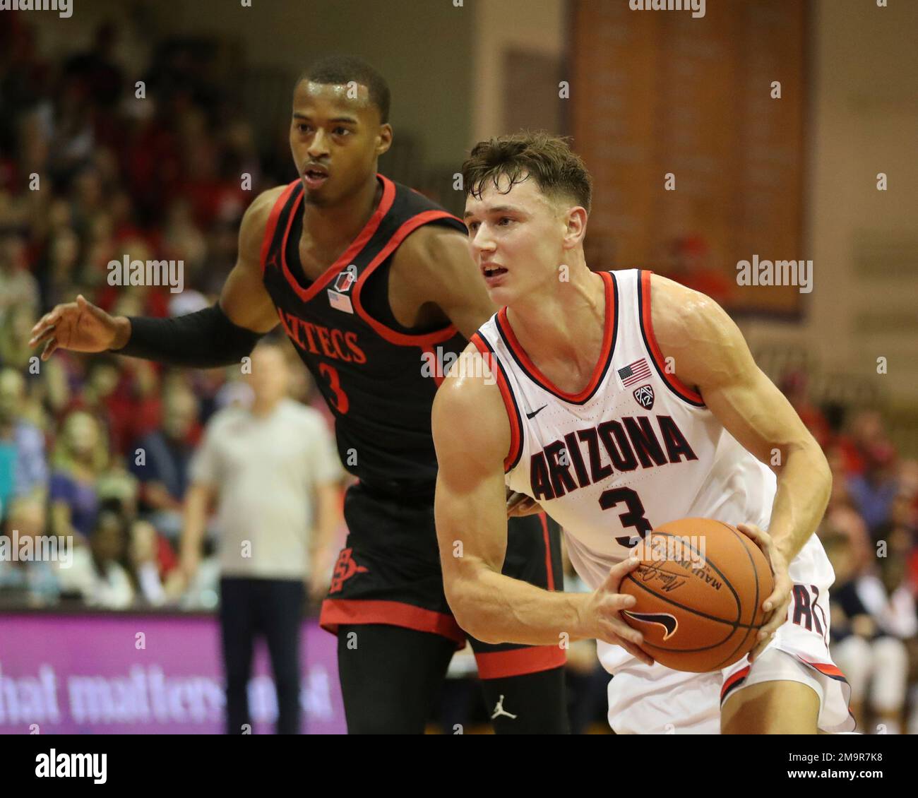 San Diego State guard Micah Parrish (3) chases Arizona guard Pelle Larsson (3) during the first ...