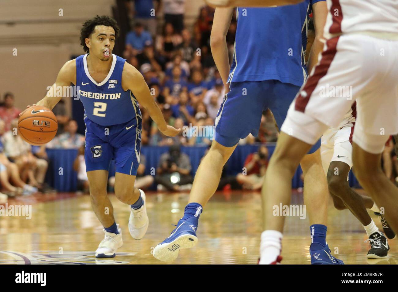 Creighton guard Ryan Nembhard (2) looks for a way through the Arkansas defense during the first ...