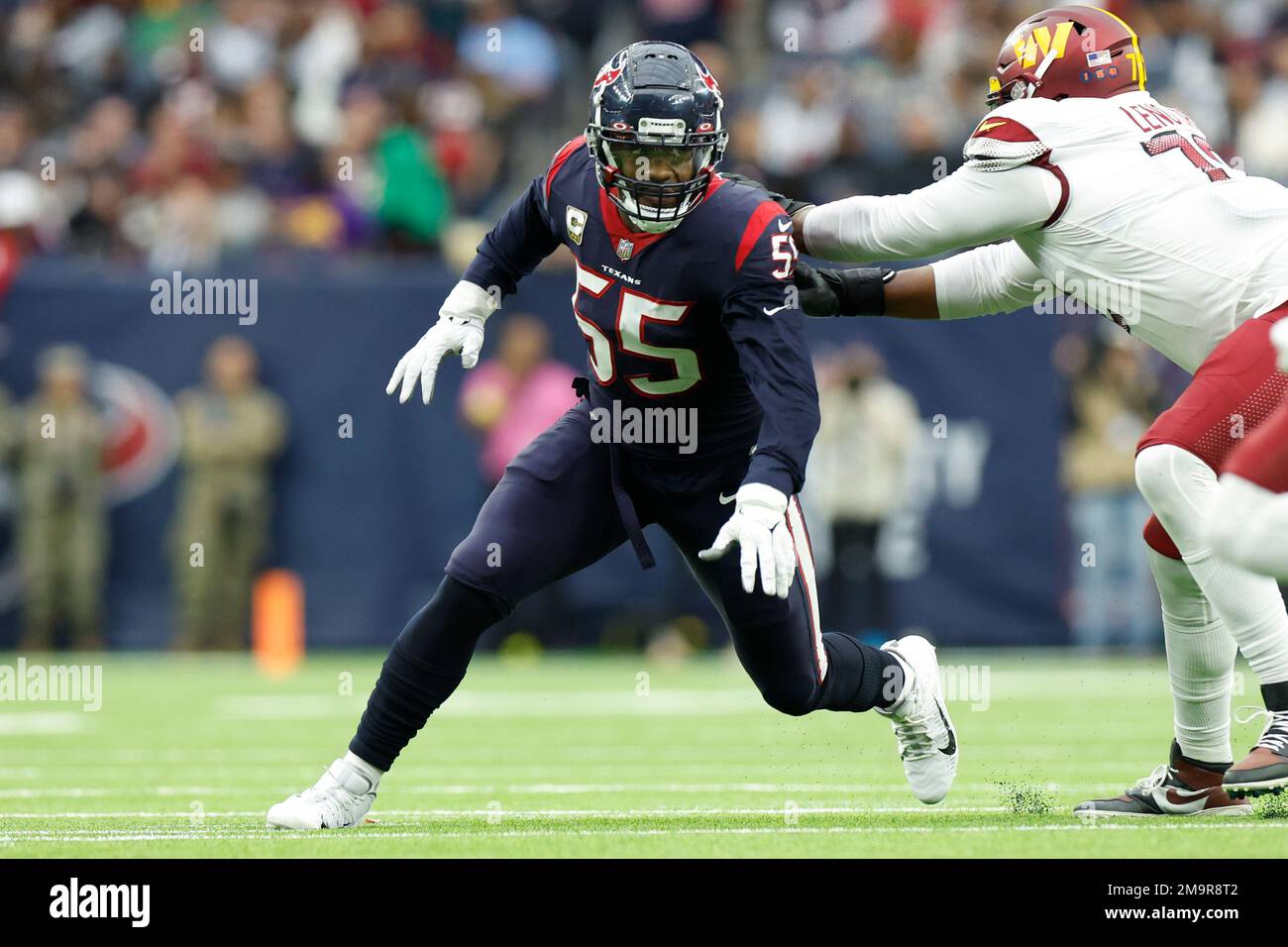 Houston Texans defensive lineman Jerry Hughes (55) rushes during an NFL ...