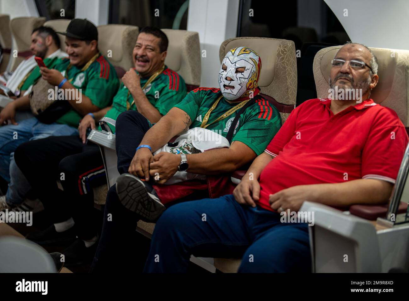 Mexican fans travel on a underground tube train in Doha, Qatar, early ...