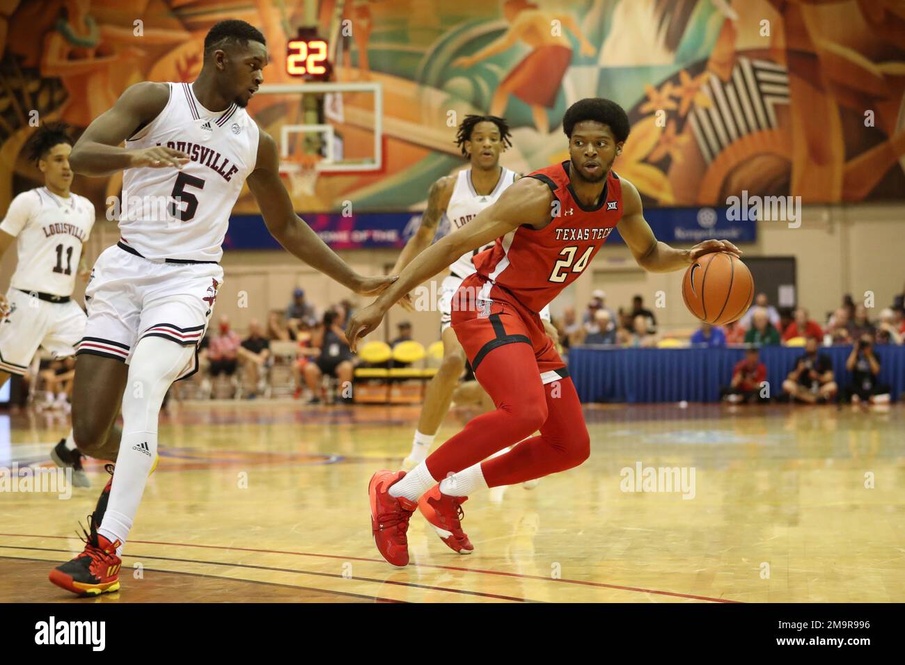 Texas Tech guard Kerwin Walton (24) tries to dribble around Louisville ...