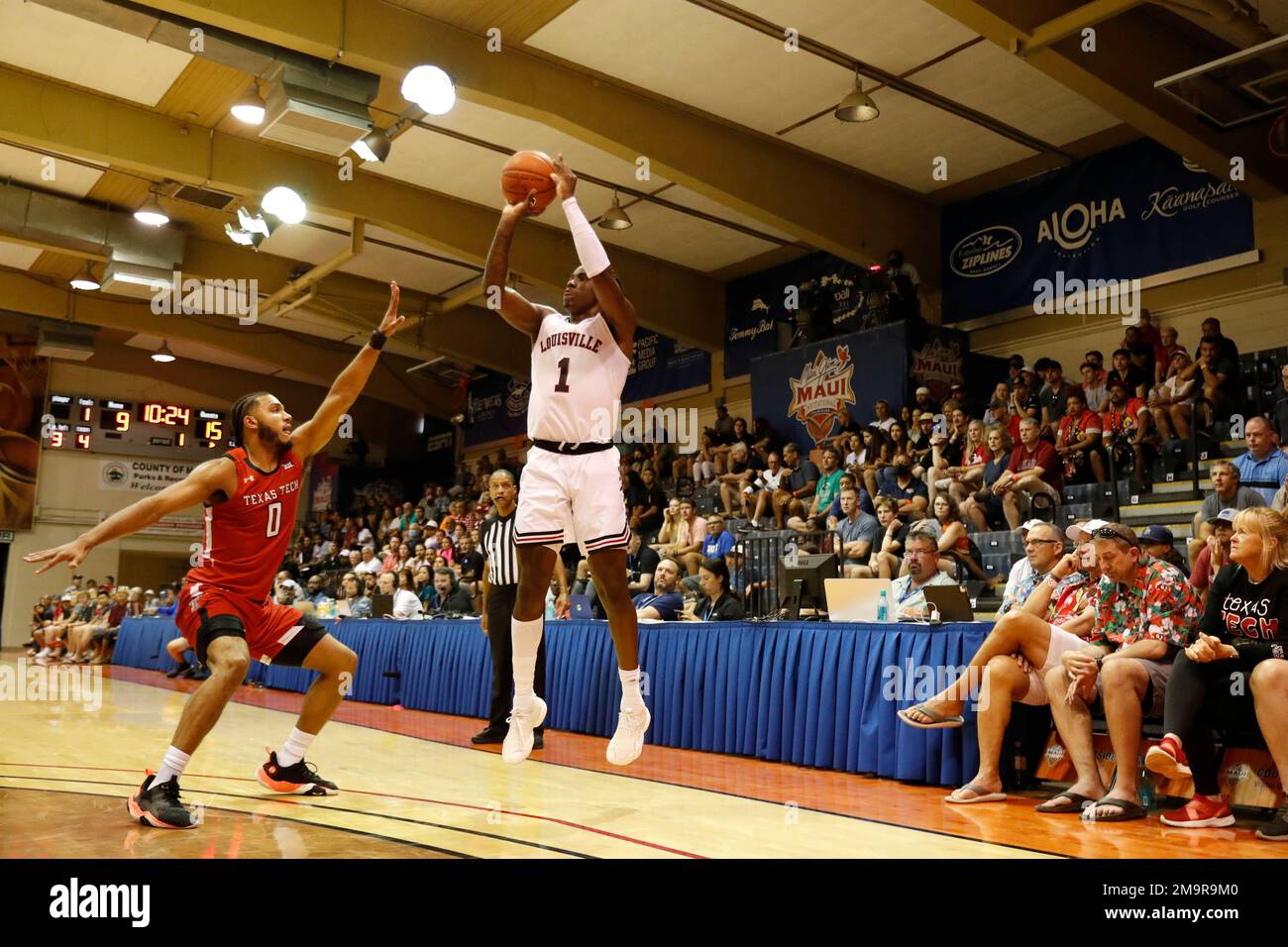 Louisville guard Mike James (1) takes a shot over Texas Tech forward ...